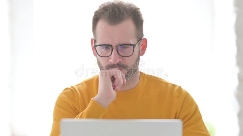 Portrait of Man Thinking while Using Laptop Stock Image - Image of ...