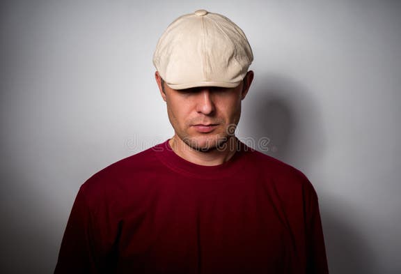 Portrait of a Man Wearing a Cap Pulled Down Stock Photo - Image of ...