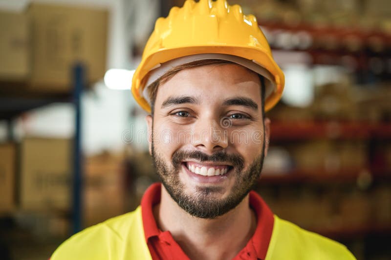 Portrait of Man Worker Smiling on Camera Inside Warehouse - Focus on ...