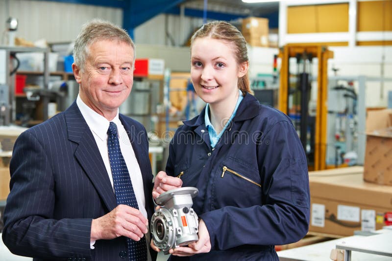 Portrait of Manager and Apprentice Engineer Inspecting Component Stock ...
