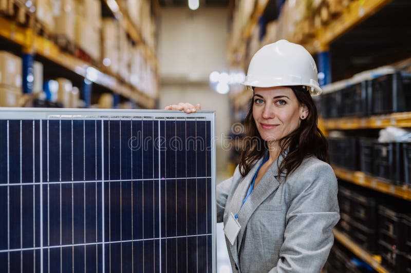 Portrait of Manager Holding a Solar Panel in a Warehouse. Stock Image ...