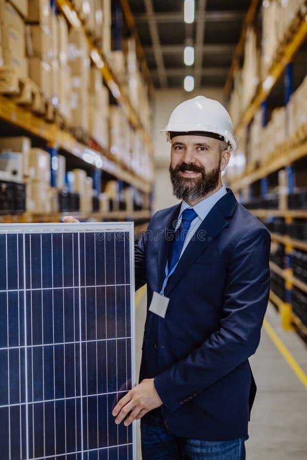 Portrait of Manager Holding a Solar Panel in a Warehouse. Stock Image ...