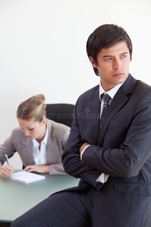 Portrait of a Manager Posing while His Colleague is Working Stock Image ...