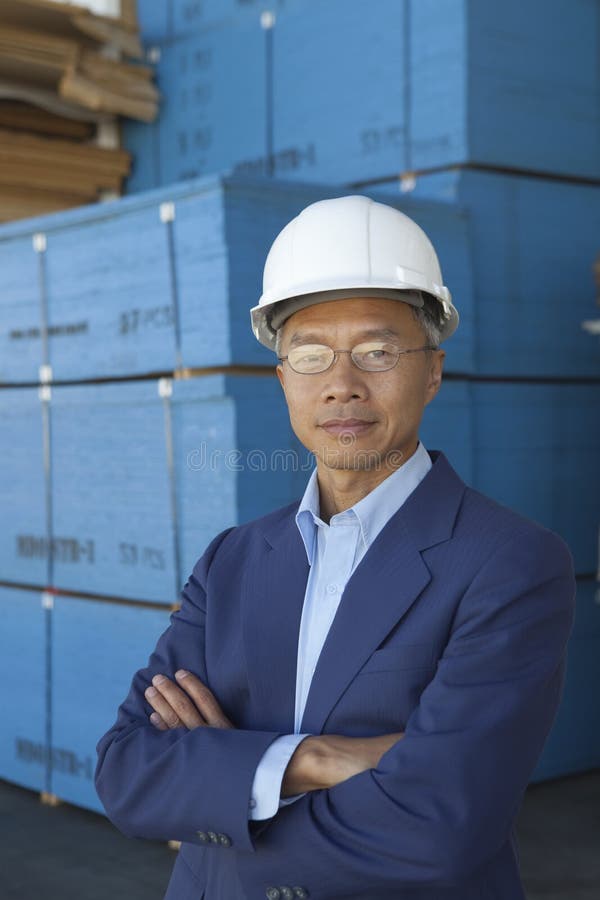 Portrait of Manager Wearing Hard Hat with Arms Crossed Stock Image ...