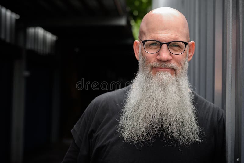 Mature Handsome Bald Bearded Man with Eyeglasses in the Streets ... Mature Handsome Bald Bearded Man with Eyeglasses in the Streets ...