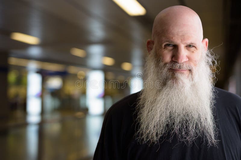 Face of Mature Handsome Bald Bearded Man at the Subway Train Station ... Face of Mature Handsome Bald Bearded Man at the Subway Train Station ...