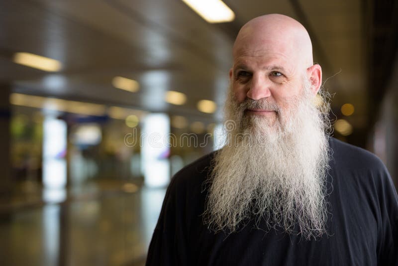 Face of Mature Handsome Bald Bearded Man Thinking at the Subway Train ... Face of Mature Handsome Bald Bearded Man Thinking at the Subway Train ...