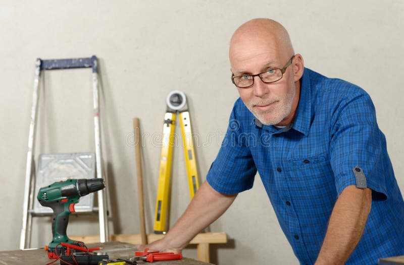 Portrait of Mature Handyman at DIY Workshop Stock Photo - Image of ...