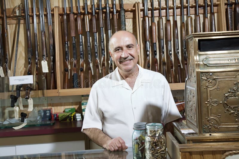 Portrait of a Mature Merchant in Gun Shop Stock Photo - Image of bald ...