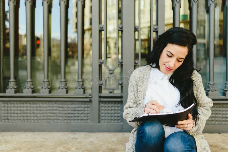 Portrait Mature Woman Taking Notes in Her Notebook, Reading Plans ...