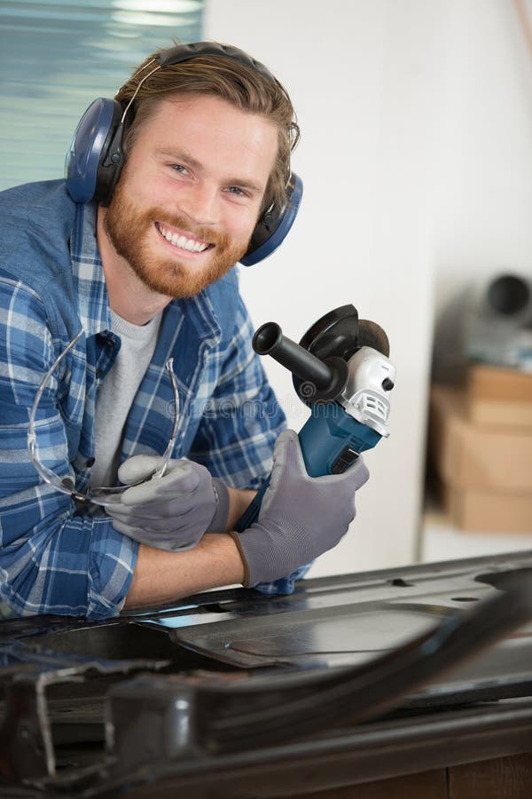 Portrait Mechanic Holding Angle Grinder Stock Photo - Image of mechanic ...