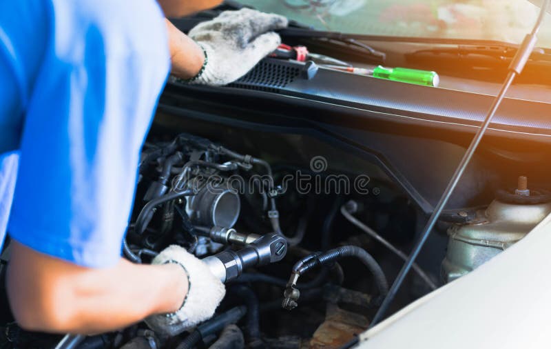 Portrait of Mechanical Repairing Engine Car in Workshop Stock Photo ...