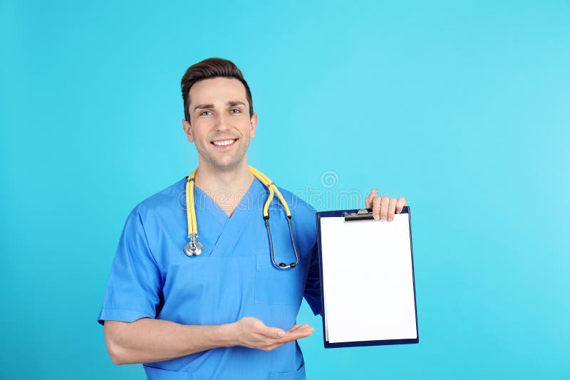 Portrait of Medical Assistant with Stethoscope and Clipboard on Color ...
