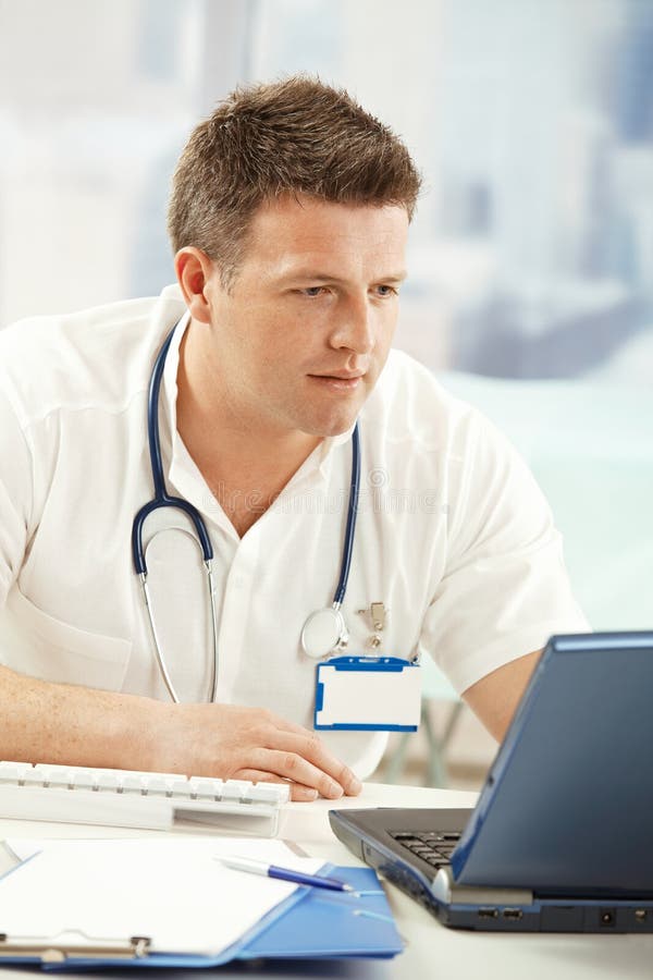 Portrait of Medical Professional Stock Image - Image of concentrating ...