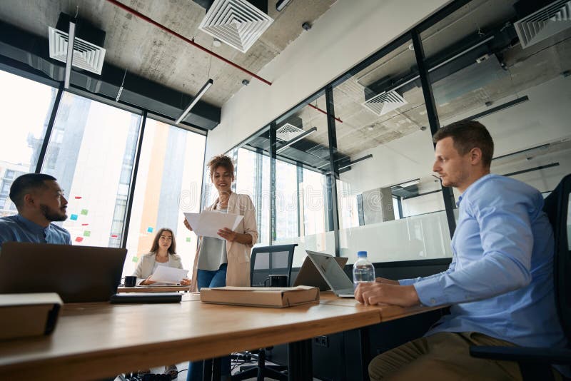Portrait of Meeting of Young Employees To Discuss Work Issues Stock ...