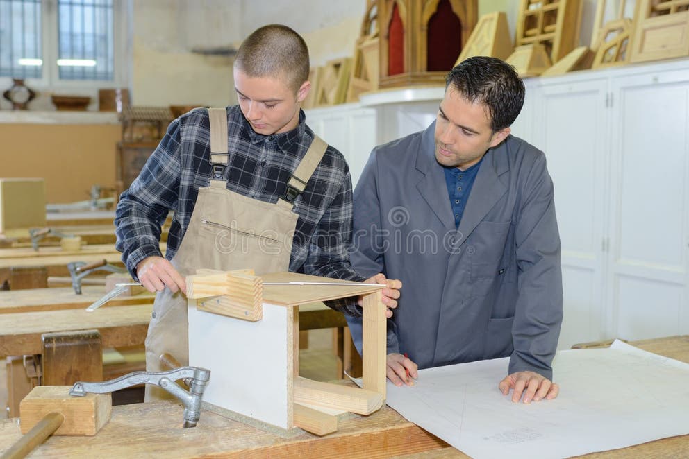 Portrait Man and Apprentice in Carpentry Class Stock Photo - Image of ...