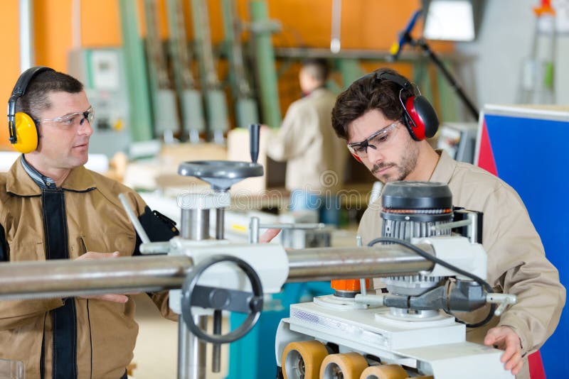 Portrait men in factory stock image. Image of assessment - 258970301