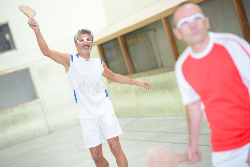 Portrait men playing pala stock image. Image of pala - 281819681