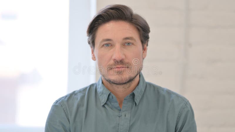 Portrait of Middle Aged Man Looking at Camera Stock Photo - Image of ...