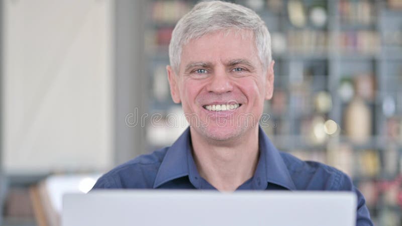 Portrait of Middle Aged Man Looking at Camera and Smiling Stock Photo ...