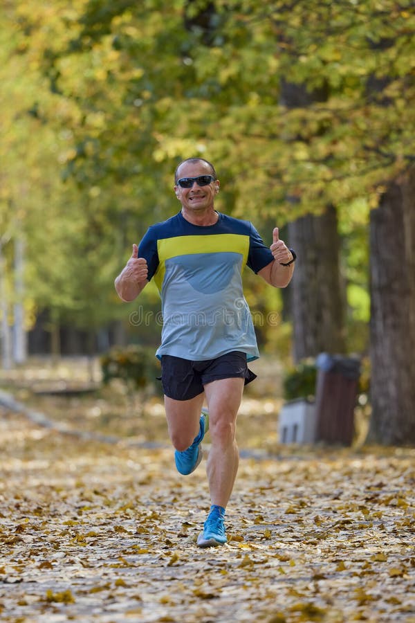 Portrait of a Middle-aged Man Running in the Park Stock Image - Image ...
