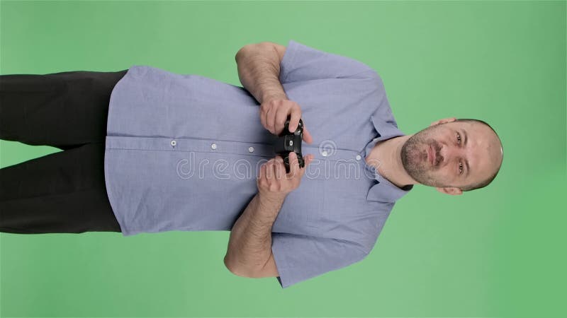 Portrait of a Middle Aged Men Playing a Video Game Using a Wireless ...