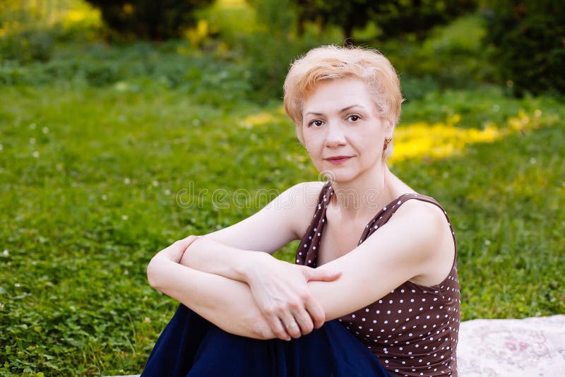 Portrait Of Middle Aged Woman Smiling In The Park Stock Image - Image ... Portrait Of Middle Aged Woman Smiling In The Park Stock Image - Image ...
