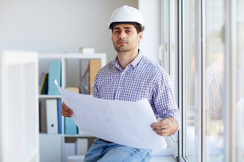 Middle-Eastern Engineer Holding Plans Stock Image - Image of engineer ...