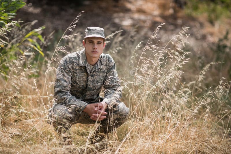 Portrait of Military Soldier Crouching in Grass Stock Photo - Image of ...