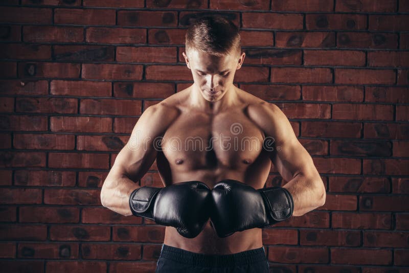 Portrait of Mma Fighter in Boxing Pose Against Brick Wall Stock Photo ...