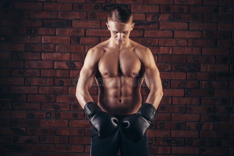 Portrait of Mma Fighter in Boxing Pose Against Brick Wall Stock Photo ...