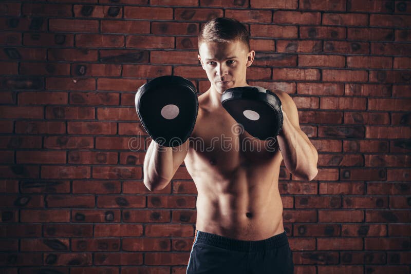 Portrait of Mma Fighter in Boxing Pose Against Brick Wall Stock Photo ...