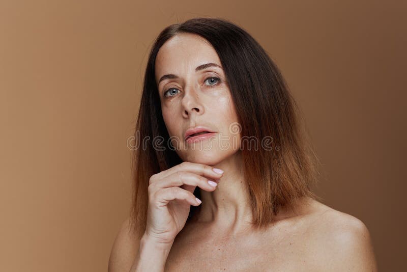 40 Years Old Woman In White Shirt Isolated On Beige Stock Illustration