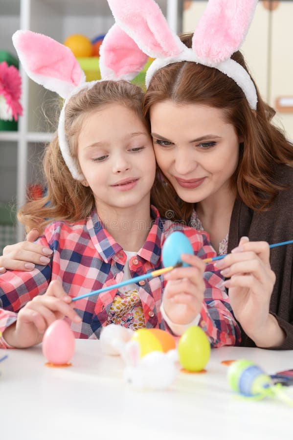 Portrait of Mother with Daughter Decorating Easter Eggs Stock Photo ...