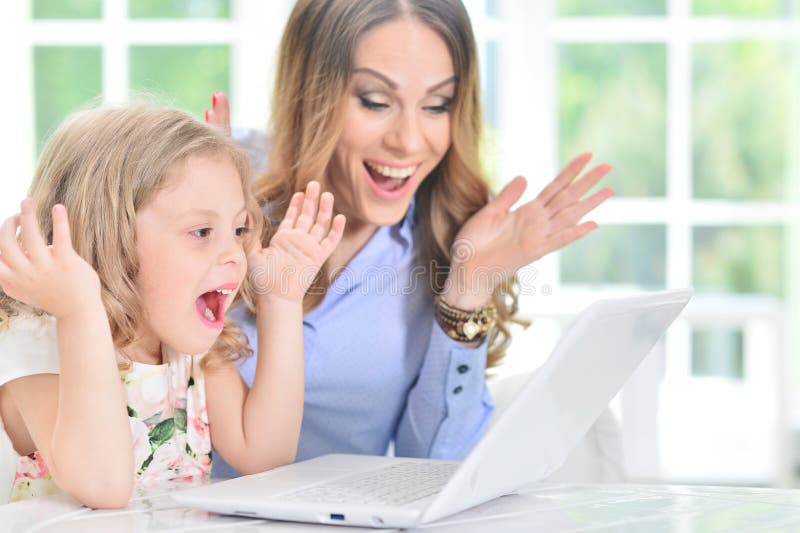 Portrait of Mother and Daughter with Laptop Computer Stock Photo ...