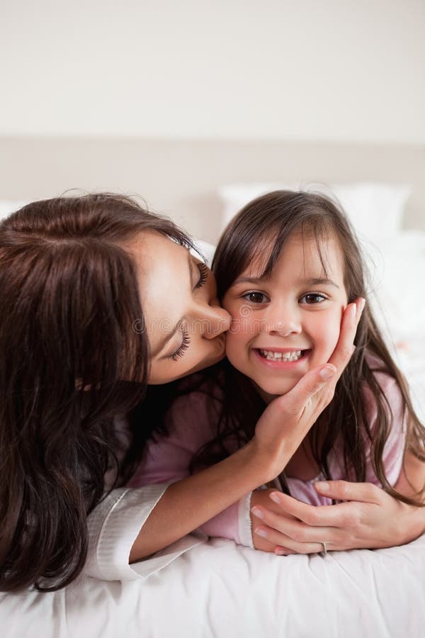 Portrait Of A Mother Kissing Her Daughter Stock Image Image 22372775