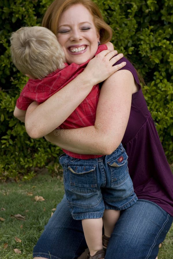 Portrait of a Mother and Son Hugging. Stock Photo - Image of outdoors ...