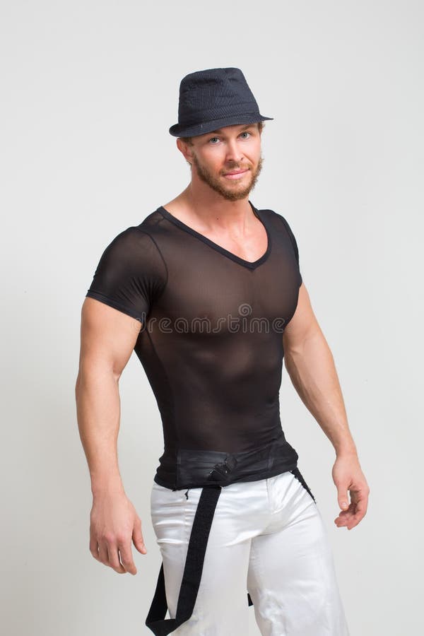 Portrait of Muscle Man in Grey T-shirt and Hat Stock Image - Image of ...
