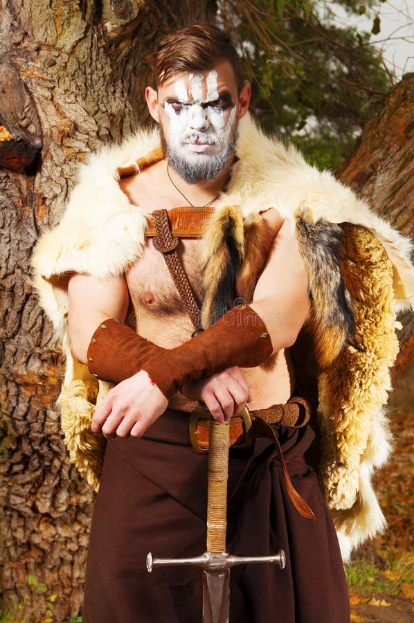 Peace, Viking Warrior, Male Dressed in Barbarian Style with Sword ...