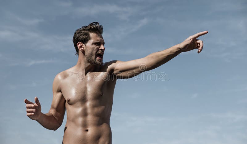 Portrait of a Muscular Man Making a Victory Gesture Stock Photo - Image ...