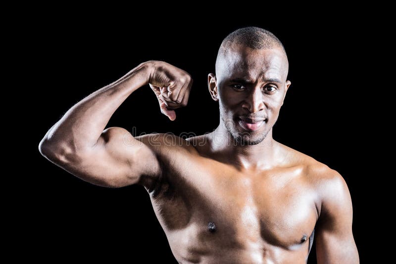 Smiling Man Flexing Muscles Stock Photo - Image of flexing, light: 31801494