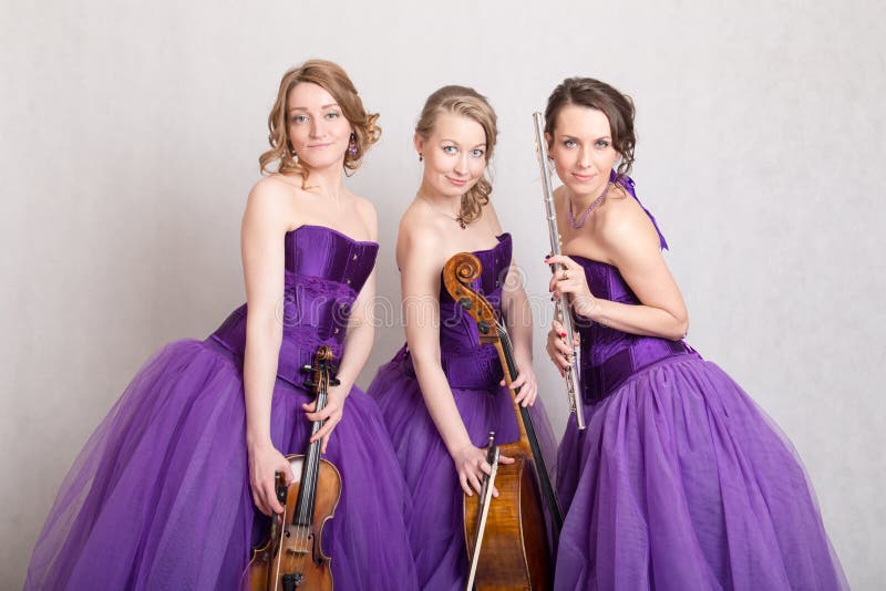 Portrait of a musical trio stock image. Image of studio - 53624663