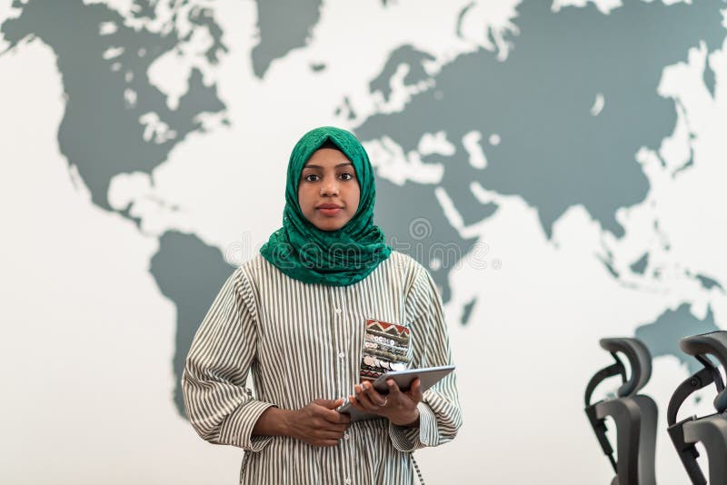Portrait of Muslim Female Software Developer with Green Hijab Holding ...