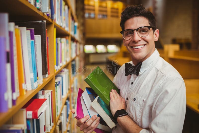 Portrait of Nerd Holding Books Stock Photo - Image of holding, campus ...