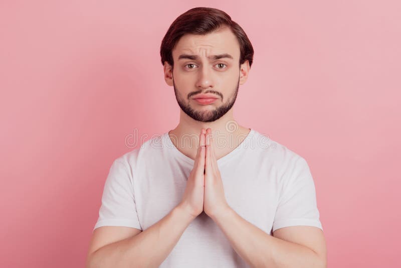 Portrait of Nervous Upset Guy Hold Palms Together Cry Ask Help on Pink ...
