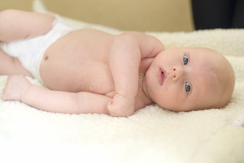 Portrait of a Newborn Baby Lying on His Side Stock Photo - Image of ...