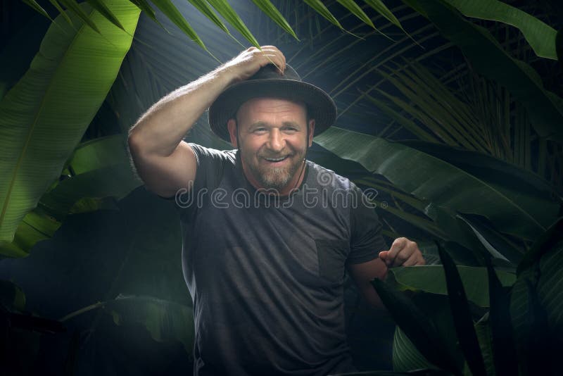 Man in Hat Exploring Jungle Environment Stock Image - Image of equator ...
