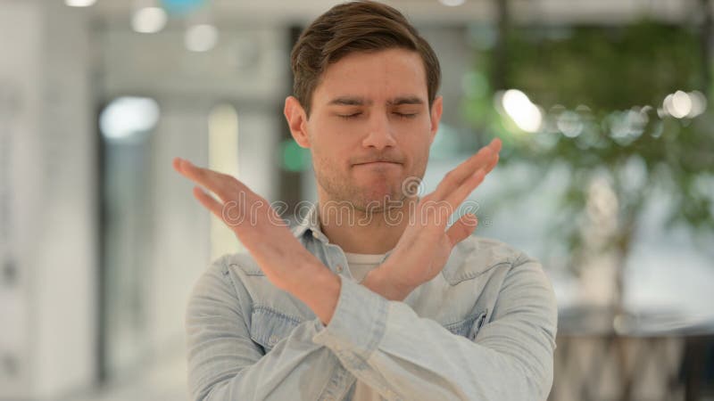 Portrait of No Sign by Young Man by Arms Gesture Stock Photo - Image of ...