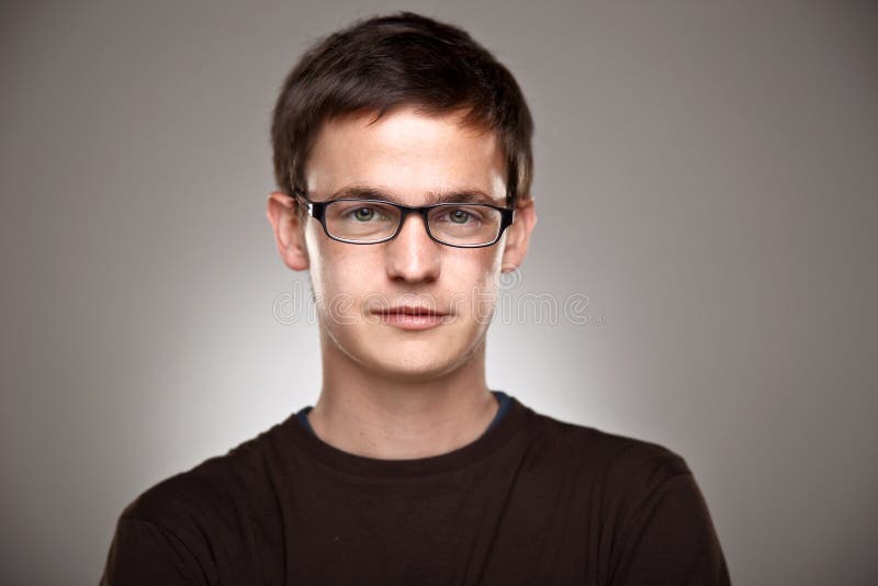 Portrait of a Normal Boy with Rimmed Glasses on a Grey Background Stock ...