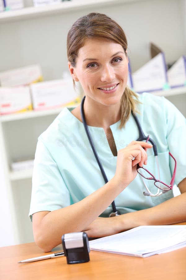 Portrait of nurse at work stock image. Image of smiling - 16561435
